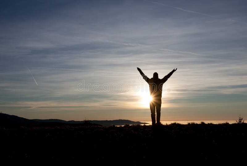 Man Standing in Sunset on Mountain Stock Image - Image of mountain ...