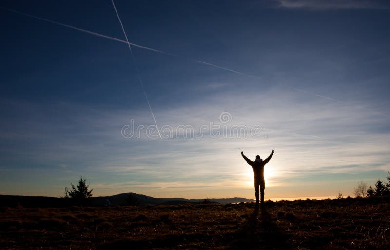 Man Standing in Sunset on Mountain Stock Image - Image of mountain ...