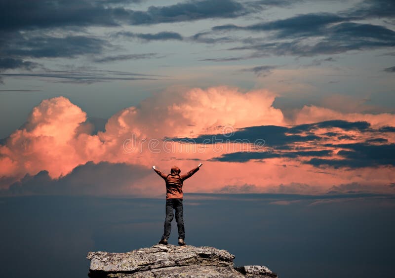 Man Standing on the Top of the Mountain Stock Image - Image of cloudy ...