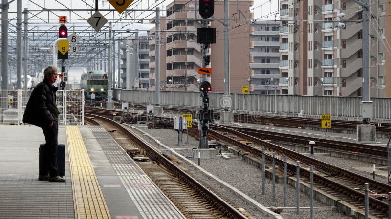 Man Standing at a Train Station Editorial Photography - Image of japan ...
