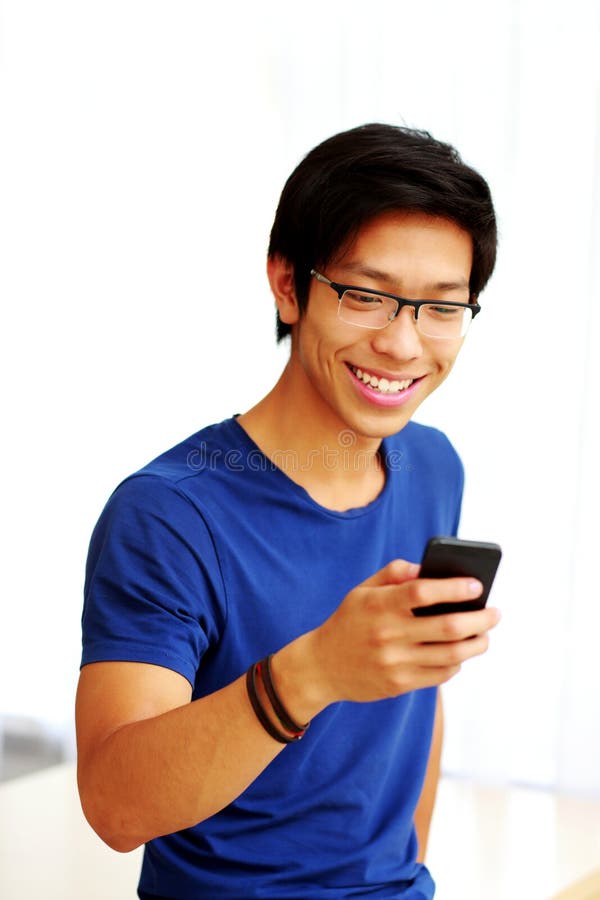Man Standing and Using Smartphone Stock Photo - Image of lifestyle ...