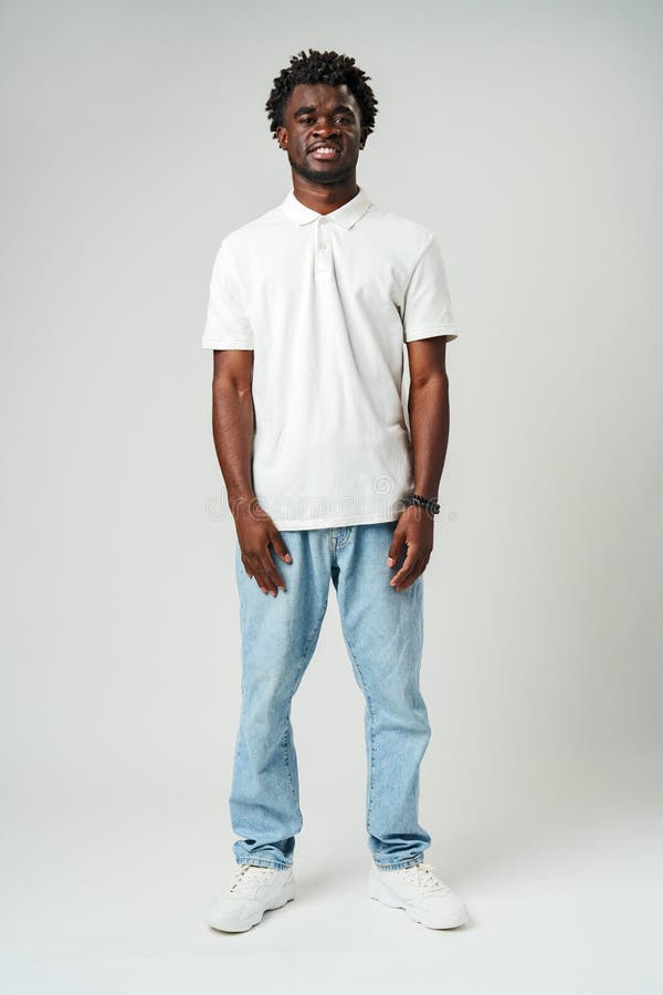 Man Standing in White Shirt and Jeans Stock Photo - Image of model ...