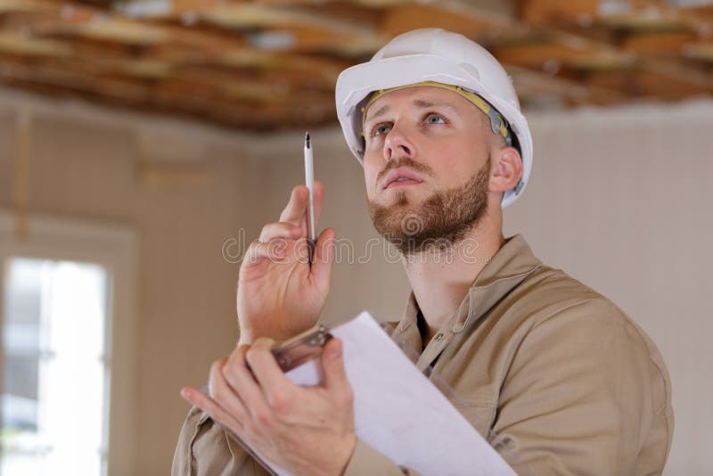 Man Standing and Writing in Folder Stock Photo - Image of business ... Man Standing and Writing in Folder Stock Photo - Image of business ...