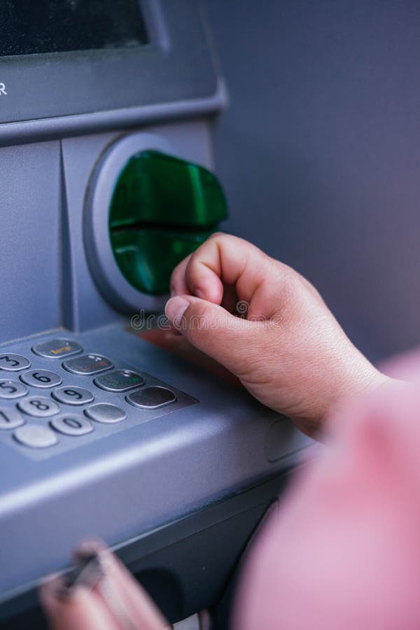 Someone Using an Atm Machine with the Keys Pointed Out in the Front ...