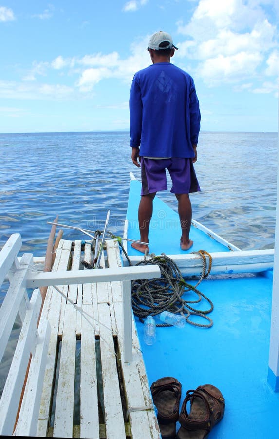 A Man Stands on the Bow of a Boat on the Sea, Philippines Editorial ...