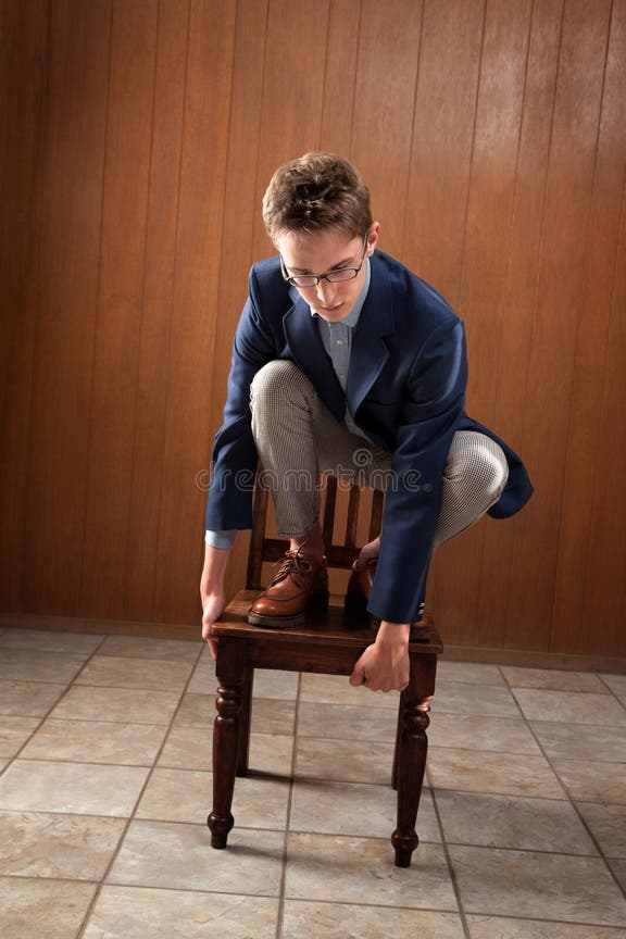 Man Stands on Chair stock photo. Image of businessman - 18840848