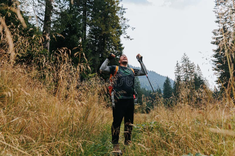 Victorious Hiker Celebrates His Successful Journey through Peaceful ...