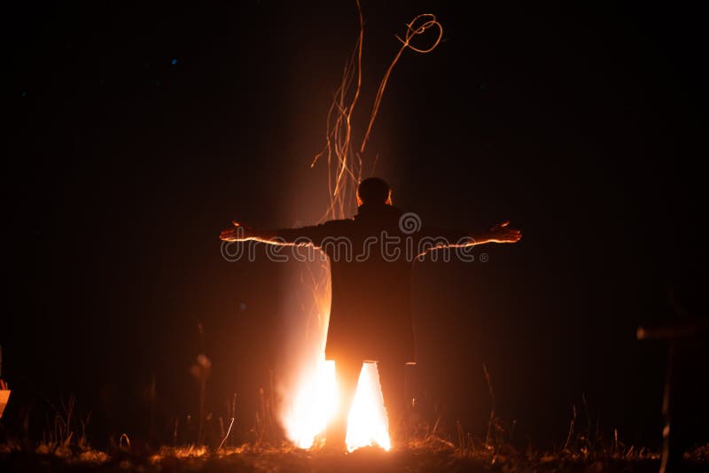 Man in Front of Fire stock image. Image of sillhouette - 57516171