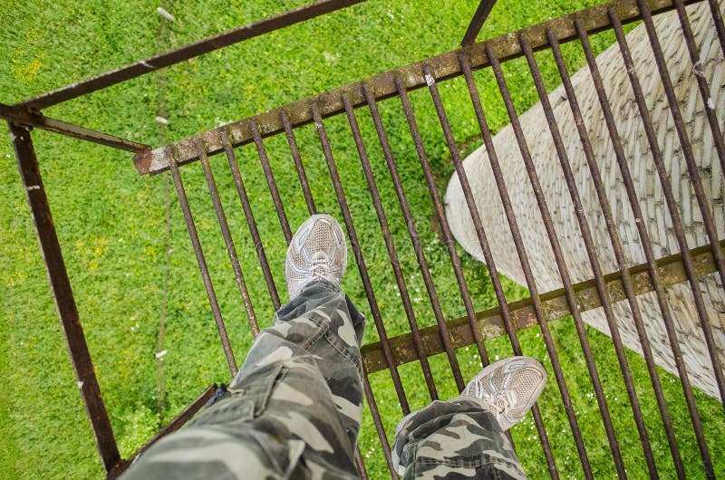 A Man Stands On A Metal Platform Of A Water Tower Stock Photo - Image ...