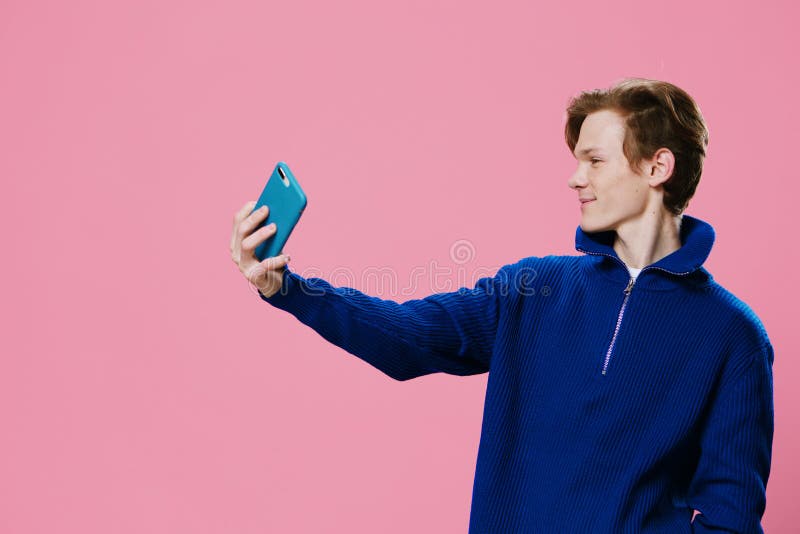 A Man Stands on a Pink Background with Space for Text Sideways To the ...