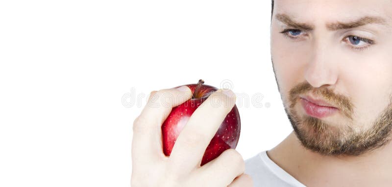 Man staring at an apple stock image. Image of fate, doubty - 18973359