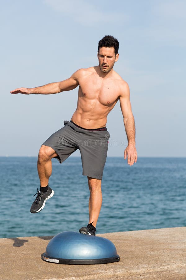 Man Staring To Balance on Platform Stock Photo - Image of flexibility ...
