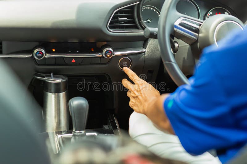 Man Starts the Car Engine with Start-stop Button. Stock Photo - Image ...