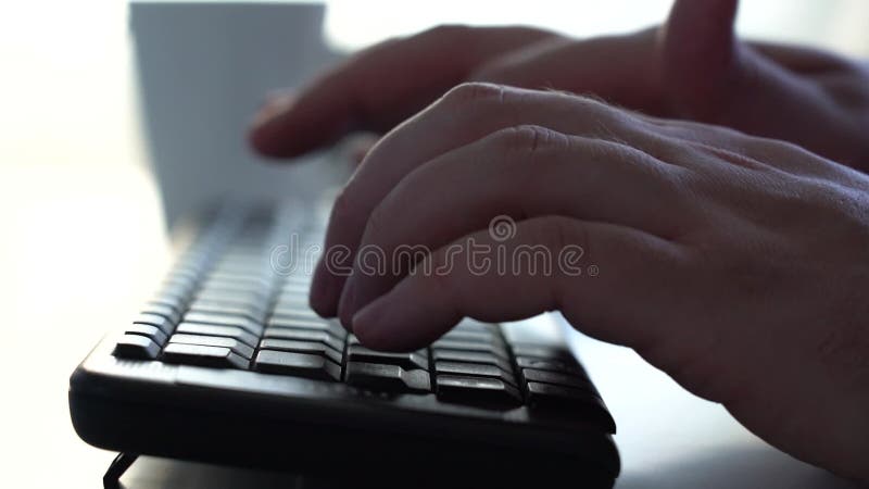 A Man Starts Typing on a Computer Keyboard. Close-up. Side View Stock ...