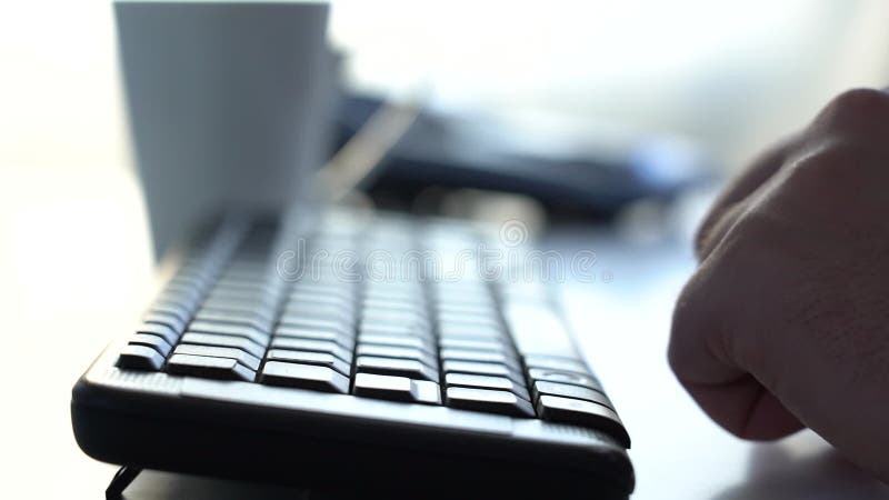 A Man Starts Typing on a Computer Keyboard. Close-up. Side View Stock ...