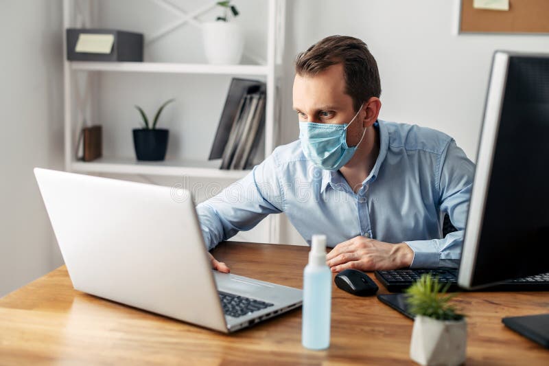 Man in a Medical Mask at the Office Stock Photo - Image of coronavirus ...