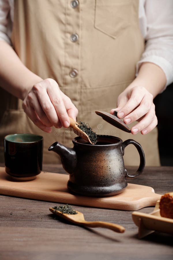 Man Steeping Tea in Ceramic Pot Stock Image - Image of drink ...