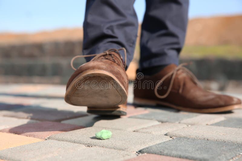 Man Stepping in Chewing Gum on Sidewalk Stock Photo - Image of accident ...