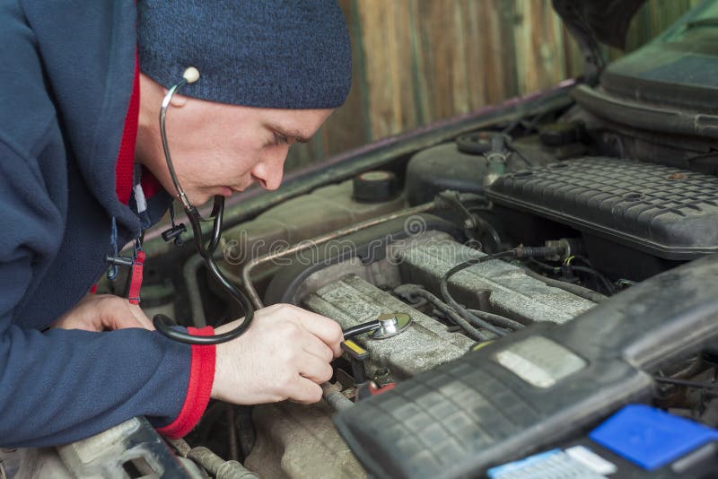 Man with Stethoscope Checking Car Engine, Auto Service Stock Image ...
