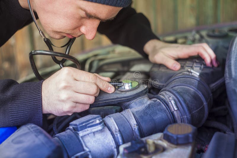 Man with Stethoscope Checking Car Engine Stock Photo - Image of battery ...