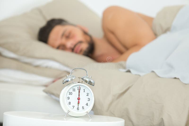Man Still Sleeping with Alarm Clock Stock Photo - Image of young ...
