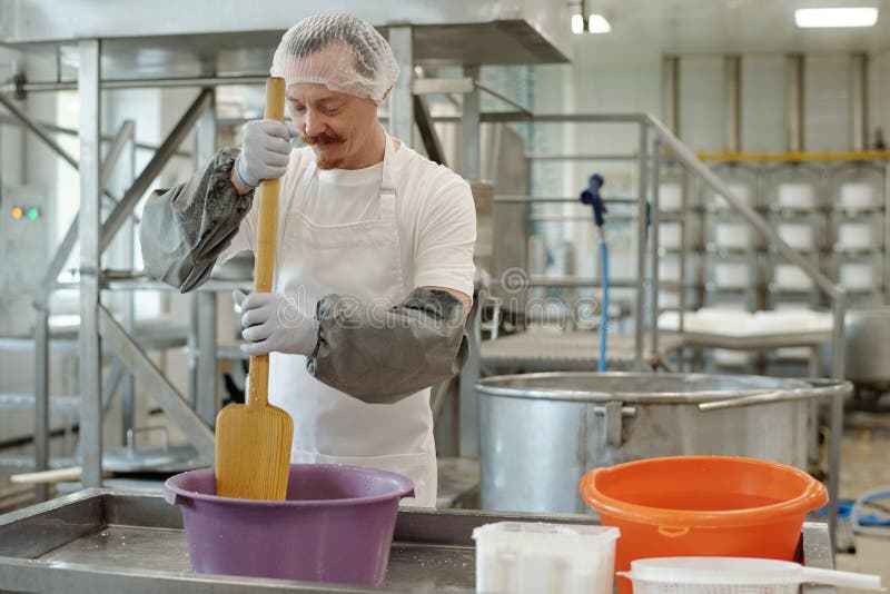 Man Stirring Mixture in Industrial Food Processing Facility Stock Image ...