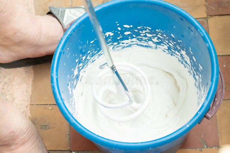 Man Stirs Putty in a Bucket Mixer Stock Image - Image of modernization ...