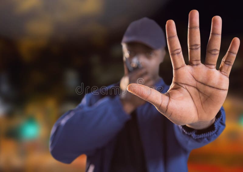 Man with Stop Hand Gesture on City Street at Night Stock Image - Image ...