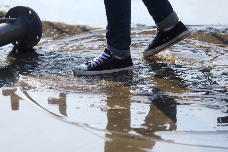 Man Stops with His Foot in a Puddle Stock Image - Image of foot, step ...