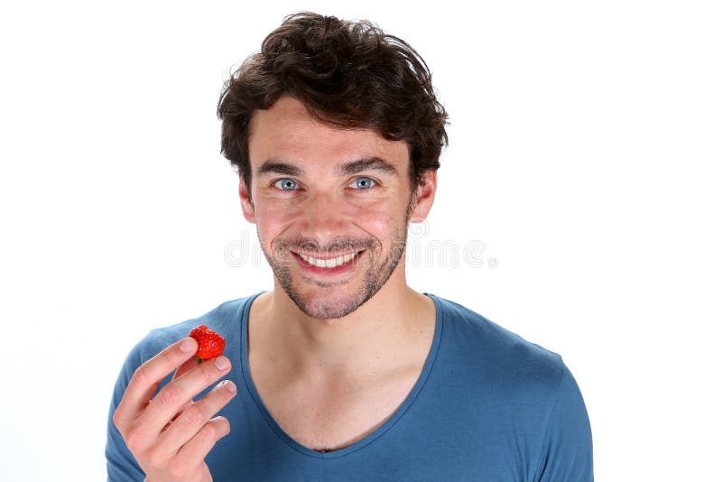 Man with strawberries stock photo. Image of brown, chew - 34039160
