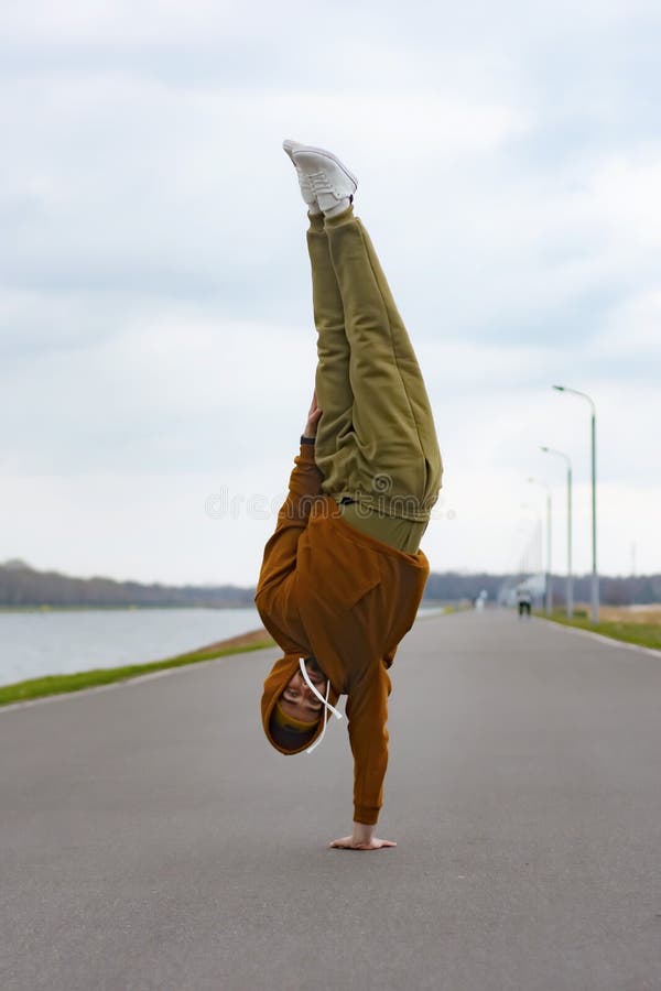 Man Street Break Dancer is Dancing in the Street. BBOY Makes an ...