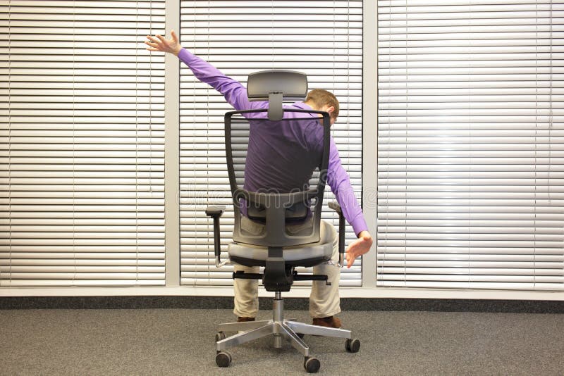 Man Stretching Arms Sitting on Chair in Office Stock Image - Image of ... Man Stretching Arms Sitting on Chair in Office Stock Image - Image of ...