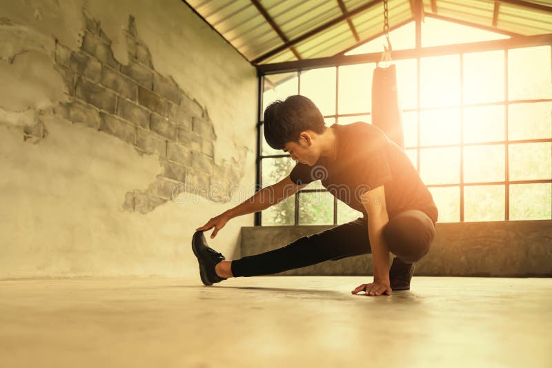 Man Stretching Out Muscles in Gym before Exercise Stock Image - Image ...