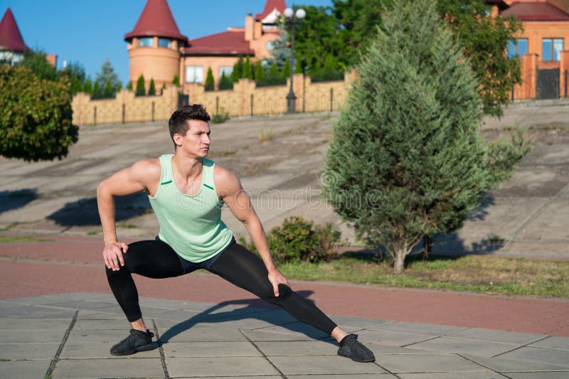 Man Stretching and Warming Up Muscles before Workout Stock Photo ...