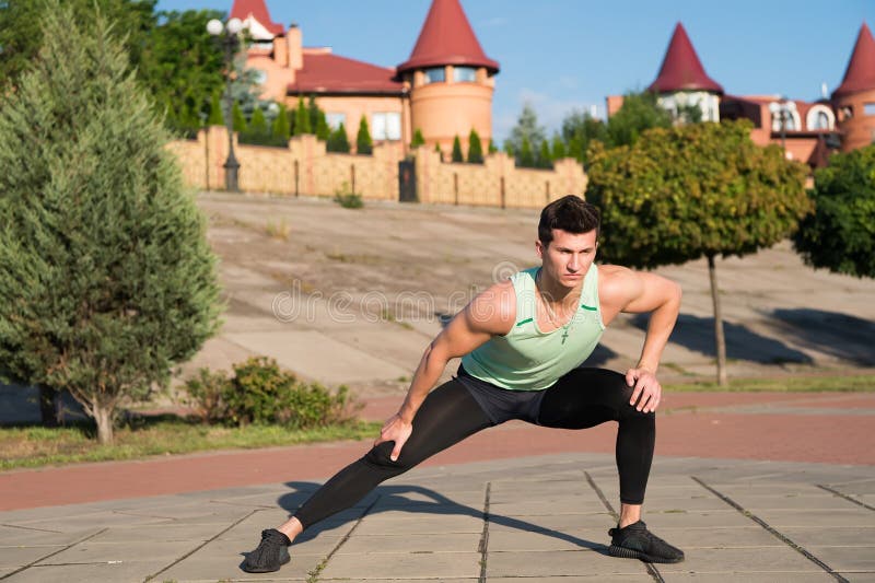 Man Stretching and Warming Up Muscles before Workout Stock Photo ...