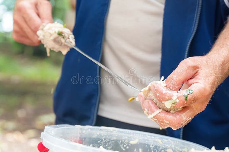 Man Stringing Marinated Meat on Skewer for Barbecue Stock Image - Image ...