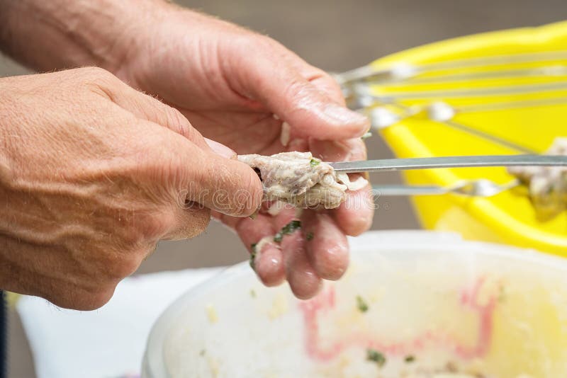 Man Stringing Marinated Meat on Skewer for Barbecue Stock Photo - Image ...
