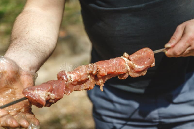 Man Stringing Meat on a Skewer. Close-up Stock Image - Image of ...