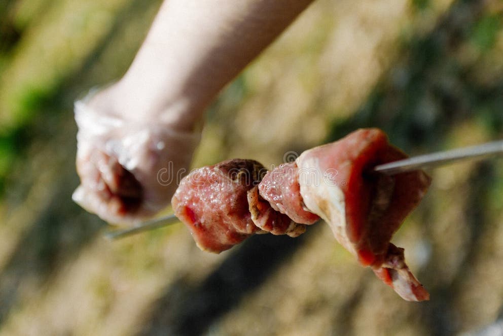 Man Stringing Meat on a Skewer. Close-up Stock Image - Image of meat ...