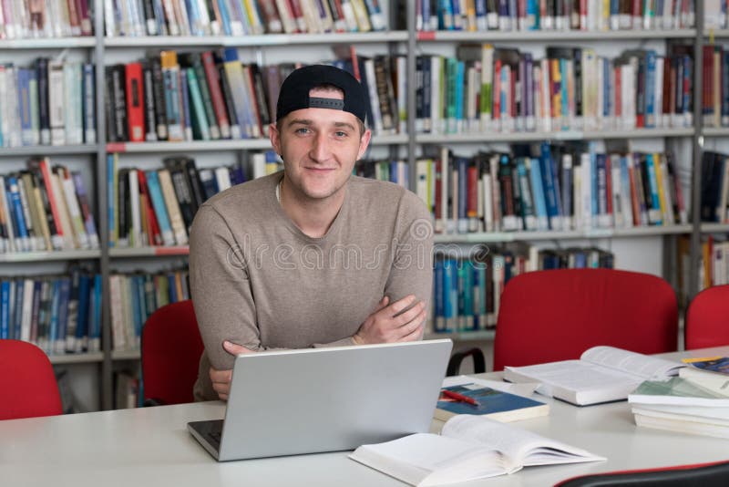 Student with Cap on Head Learning in Library Stock Image - Image of ...