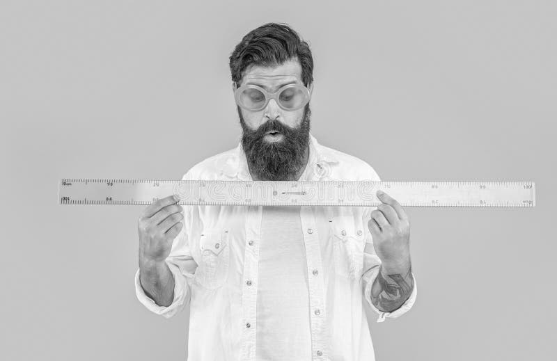 Man Student Hold Measuring Ruler in Studio. Man Hold Measuring Ruler on ...