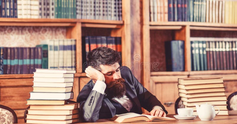 Man Studies Book at His Desk in the Offic Stock Image - Image of ...