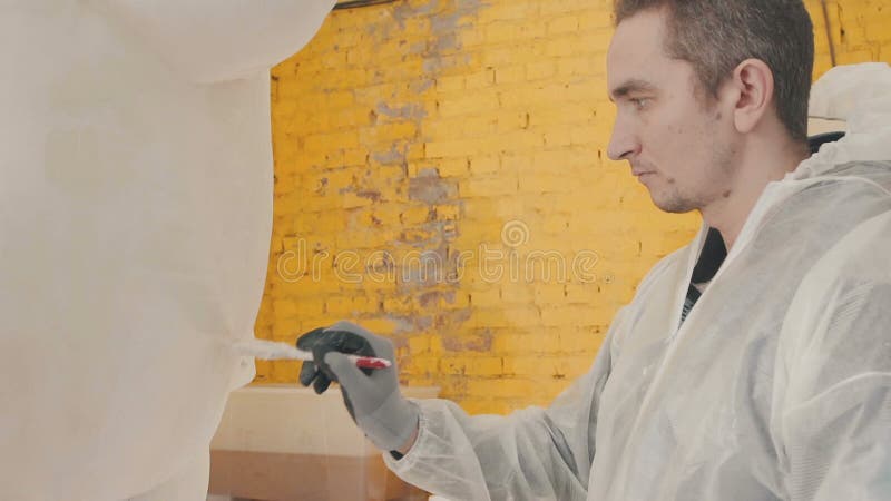 Man in the Studio Paints a Figure of Polystyrene Foam Stock Video ...