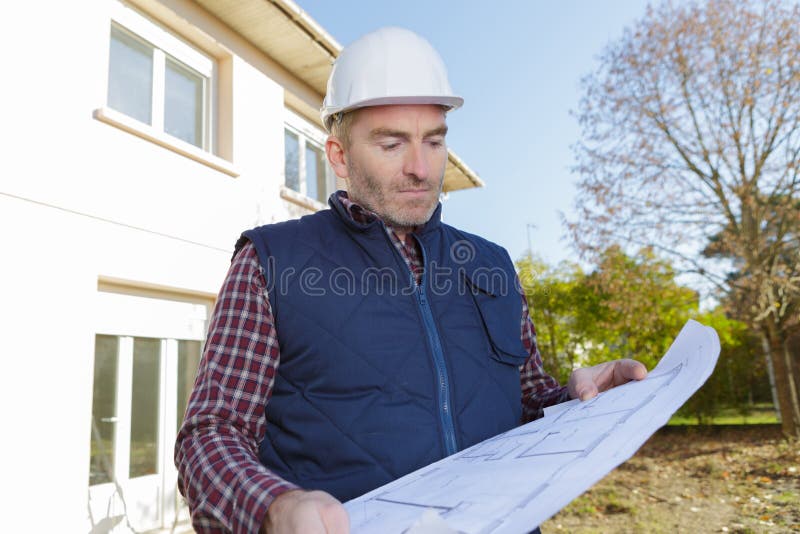 Man during study blueprint stock photo. Image of architect - 261156978