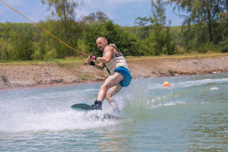 Man Study Wakeboarding on a Blue Lake Stock Photo - Image of lifestyle ...