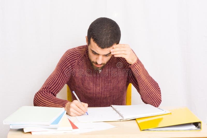 Handsome Young Man Studying and Reading a Book on Stock Image - Image ...