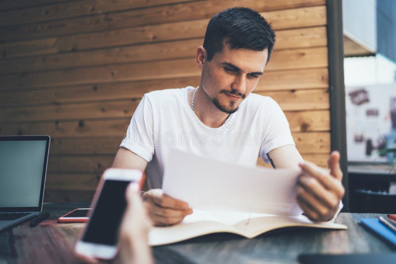Man Studying Business Document in Workspace,using Devices Stock Photo ...