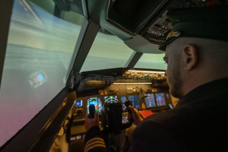 A Man is Studying To Be a Pilot in a Flight Simulator. Close-up of Male ...