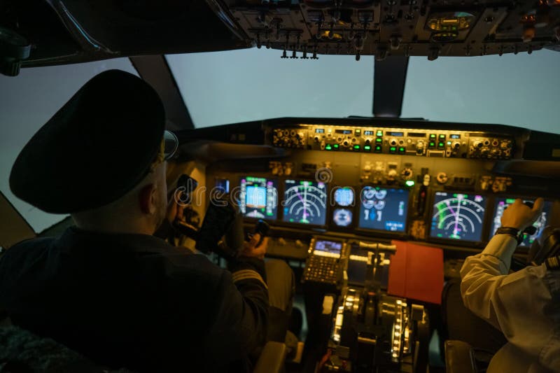 A Man is Studying To Be a Pilot in an Aircraft Simulator. Stock Image ...