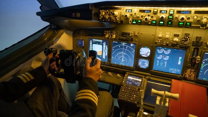 A Man is Studying To Be a Pilot in a Flight Simulator. Close-up of Male ...